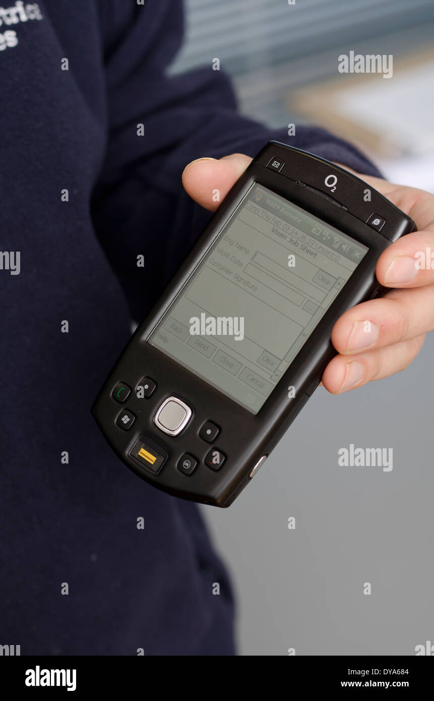 Signature device from courier held in male hand hi-res stock ...