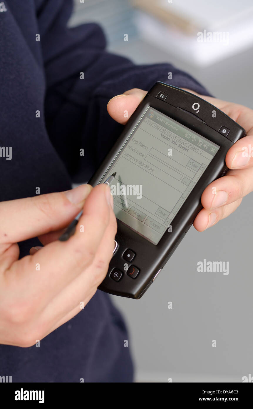 Delivery person tapping screen to confirm signature Stock Photo - Alamy