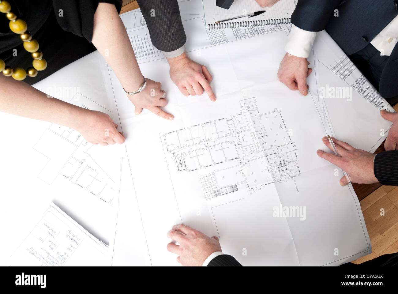 Hands on a floor plan of a house hi-res stock photography and images ...