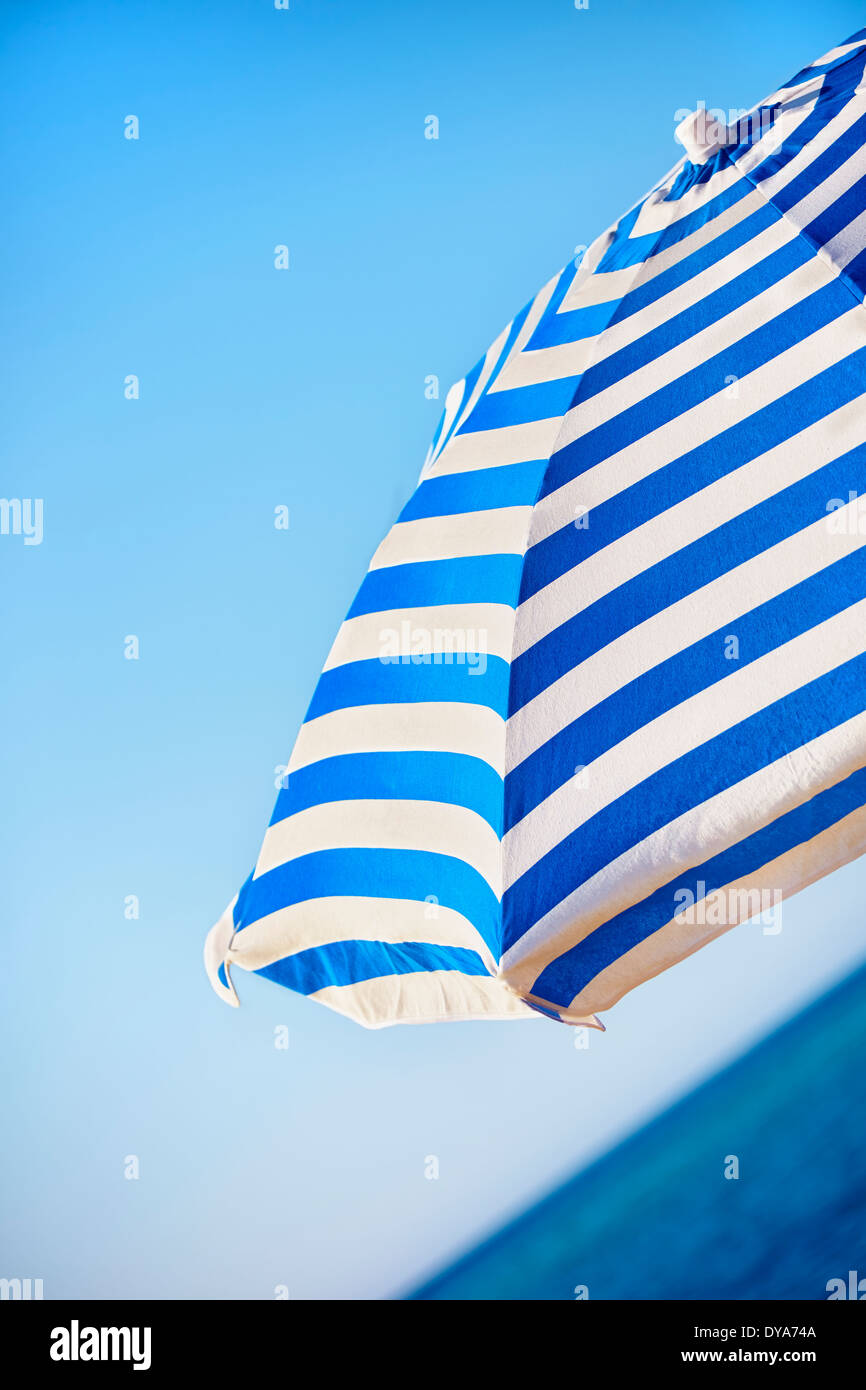 Striped sun umbrella at the beach. Denia. Alicante. Spain Stock Photo ...