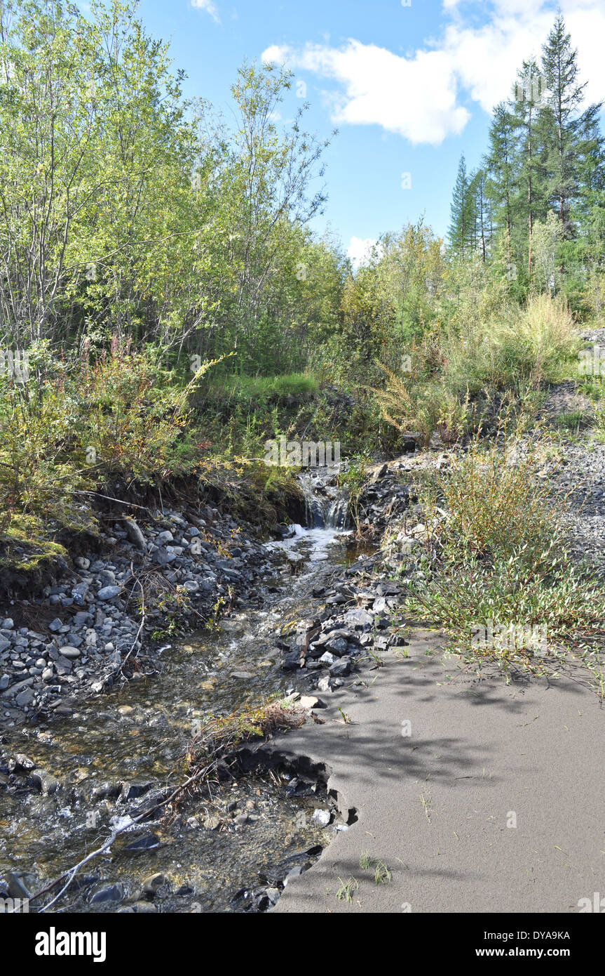 Stream, babbling over the rocks in Yakutia. Ridge Suntar-khayata, river ...