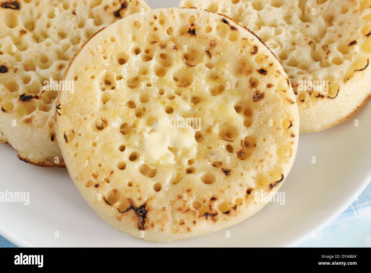 Hot buttered crumpets Stock Photo - Alamy