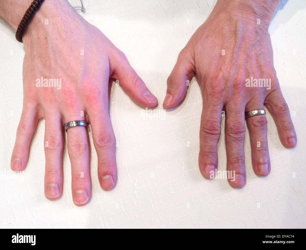 Two generations of hands. April 2014 Stock Photo - Alamy