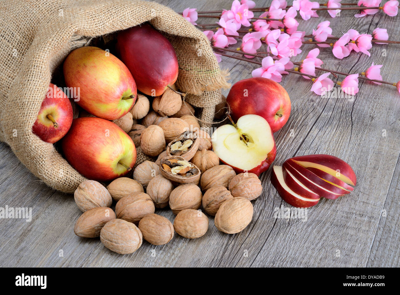 sack of nut and red delicious apples with flowers Stock Photo - Alamy
