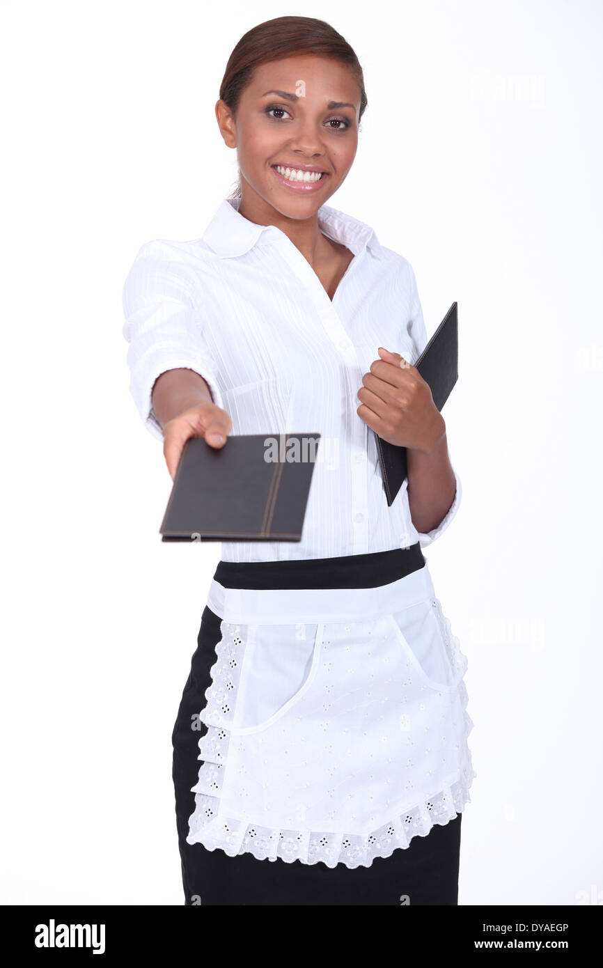 black waitress giving a menu Stock Photo - Alamy