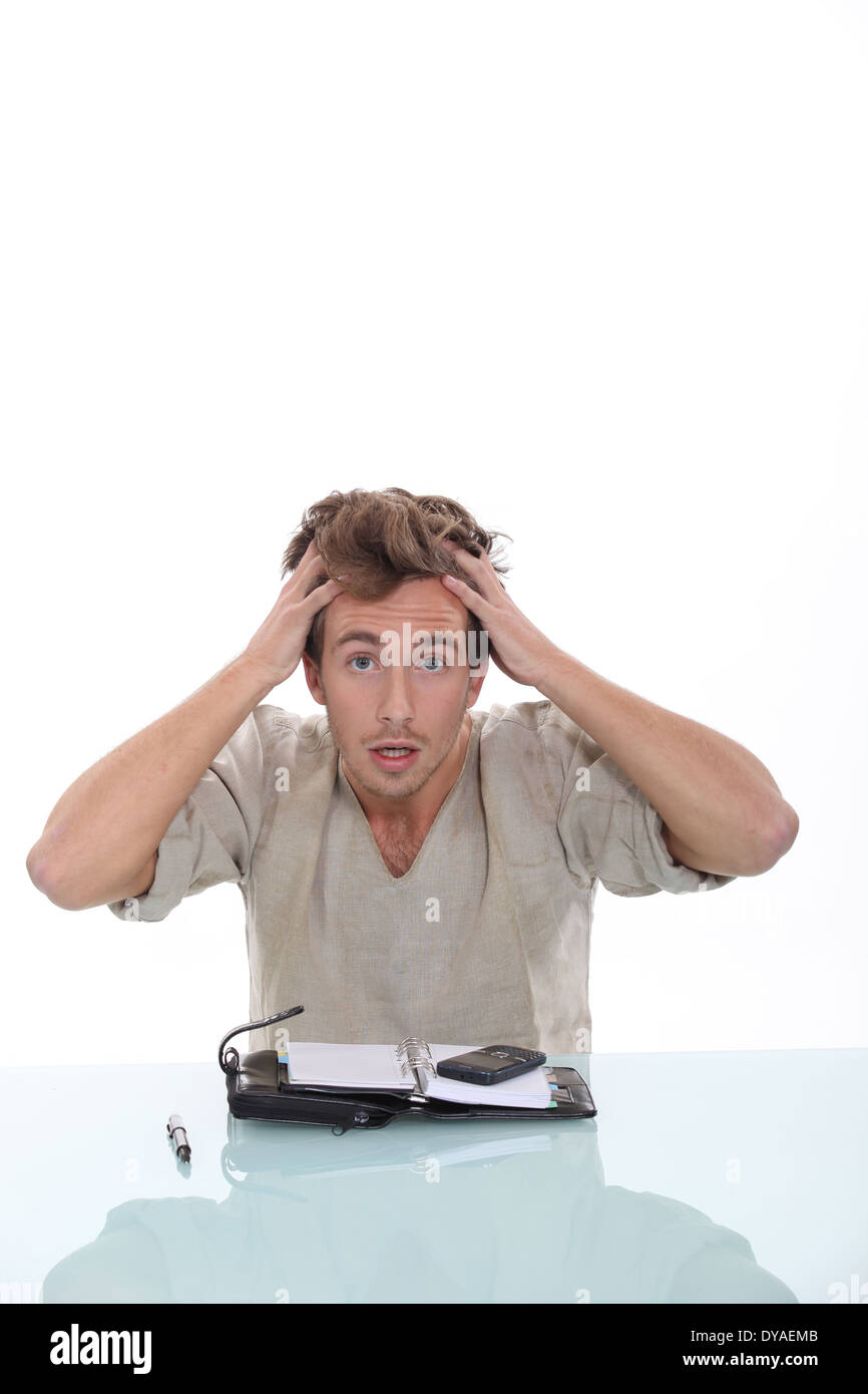 Man pulling his hair out Stock Photo - Alamy