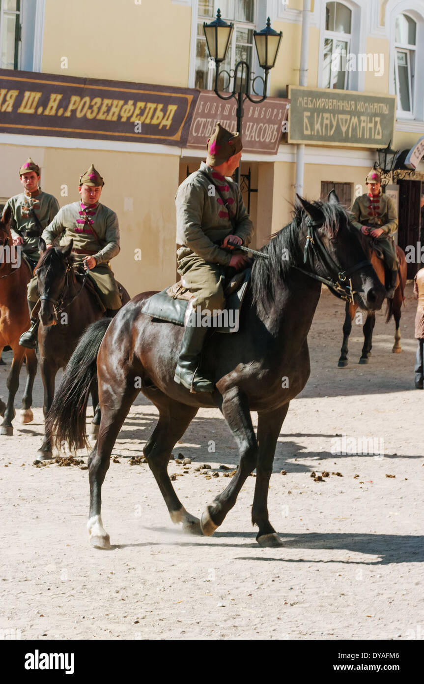 Festive parade on the city street. Red Army soldiers on the horses ...
