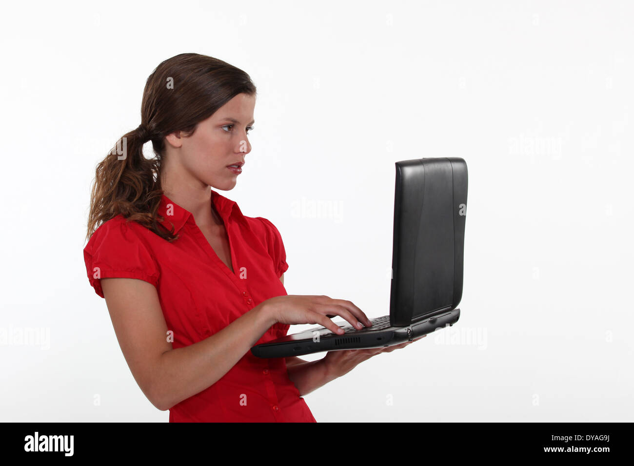 Woman standing and typing Stock Photo - Alamy