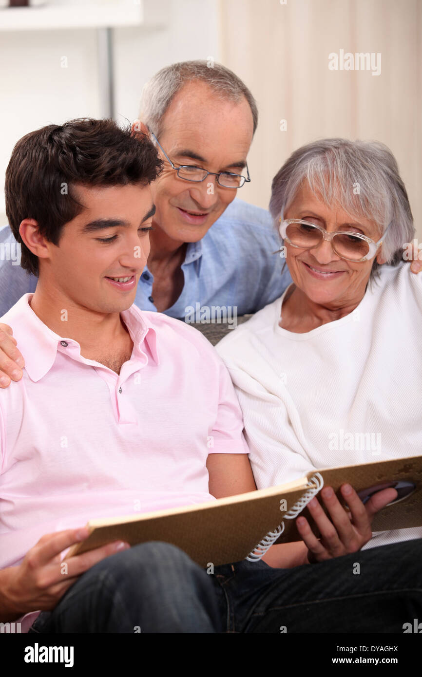 Family looking at photos Stock Photo - Alamy