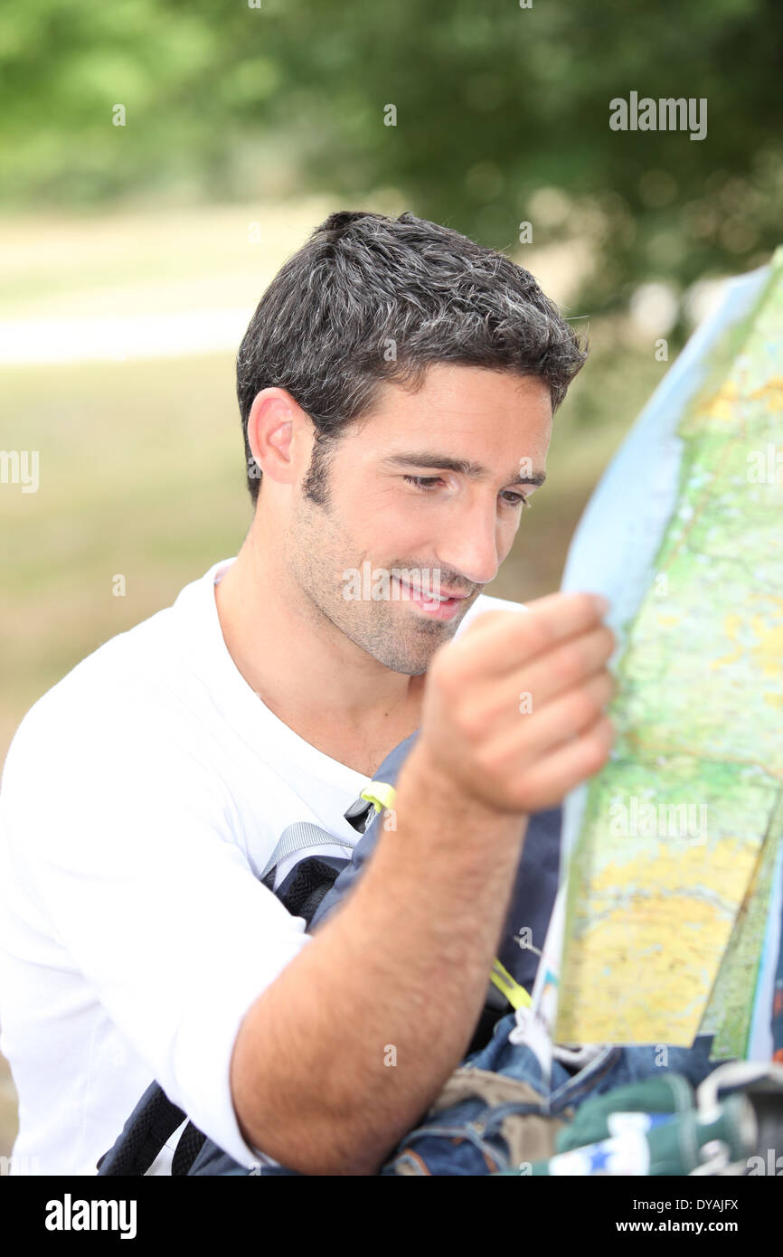 Man looking at map for directions Stock Photo - Alamy