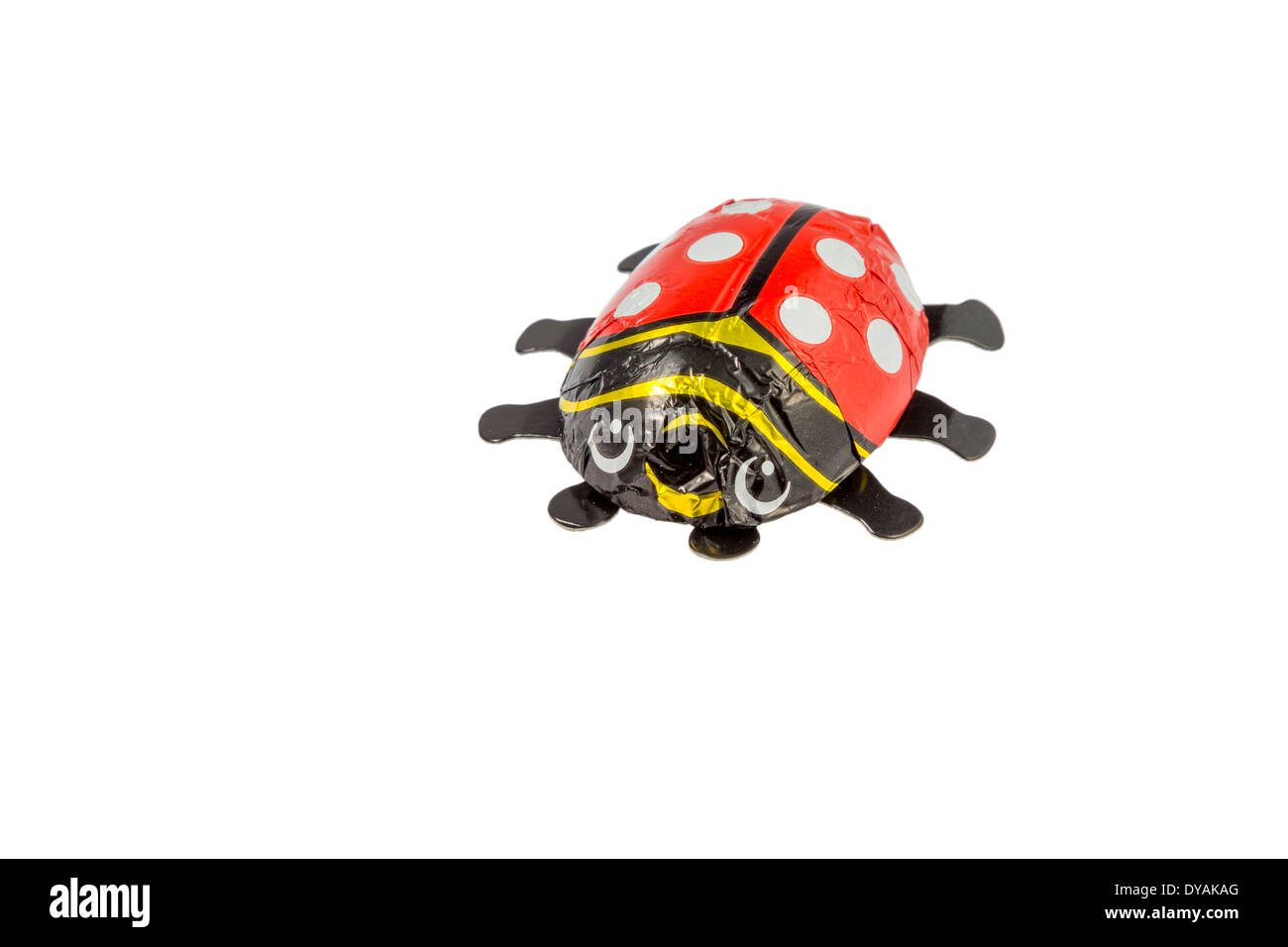 chocolate ladybird wrapped in aluminum foil isolated on white ...
