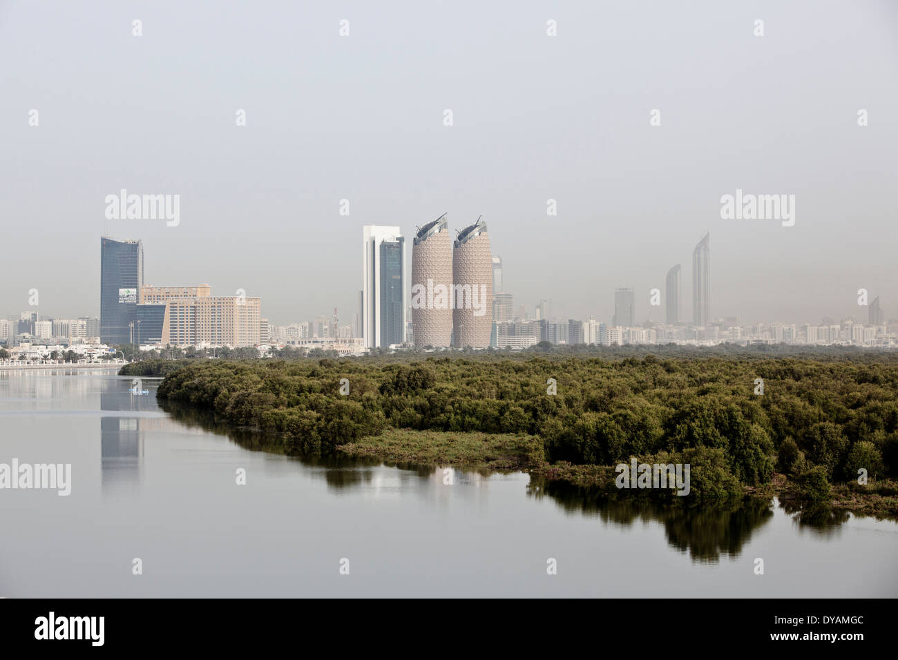 Al Bahar Tower and the city of Abu Dhabi stand above the mangroves ...