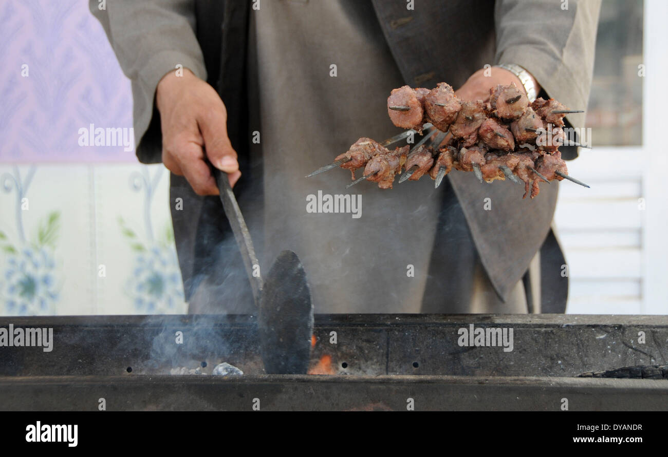 Balkh, Afghanistan. 10th Apr, 2014. An Afghan man makes traditional ...