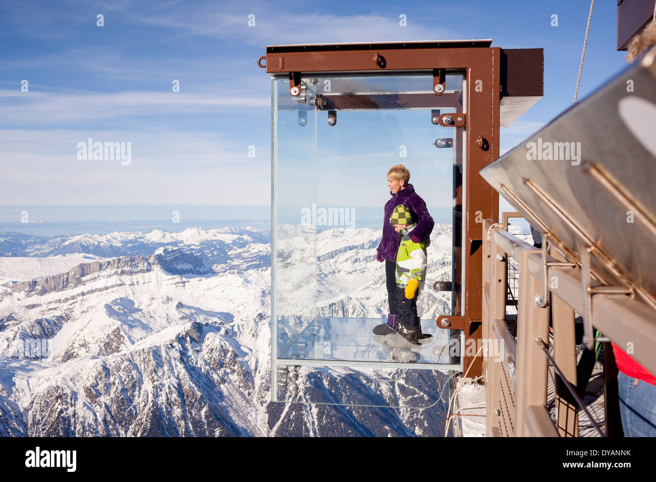 A tourist stands in the 'Step into the Void' glass box on the Aiguille Du Midi (3842m) mountain ...
