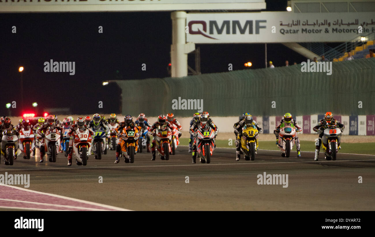Losail Circuit, Doha, Qatar 23rd March 2014. Moto 2 riders wait on the ...