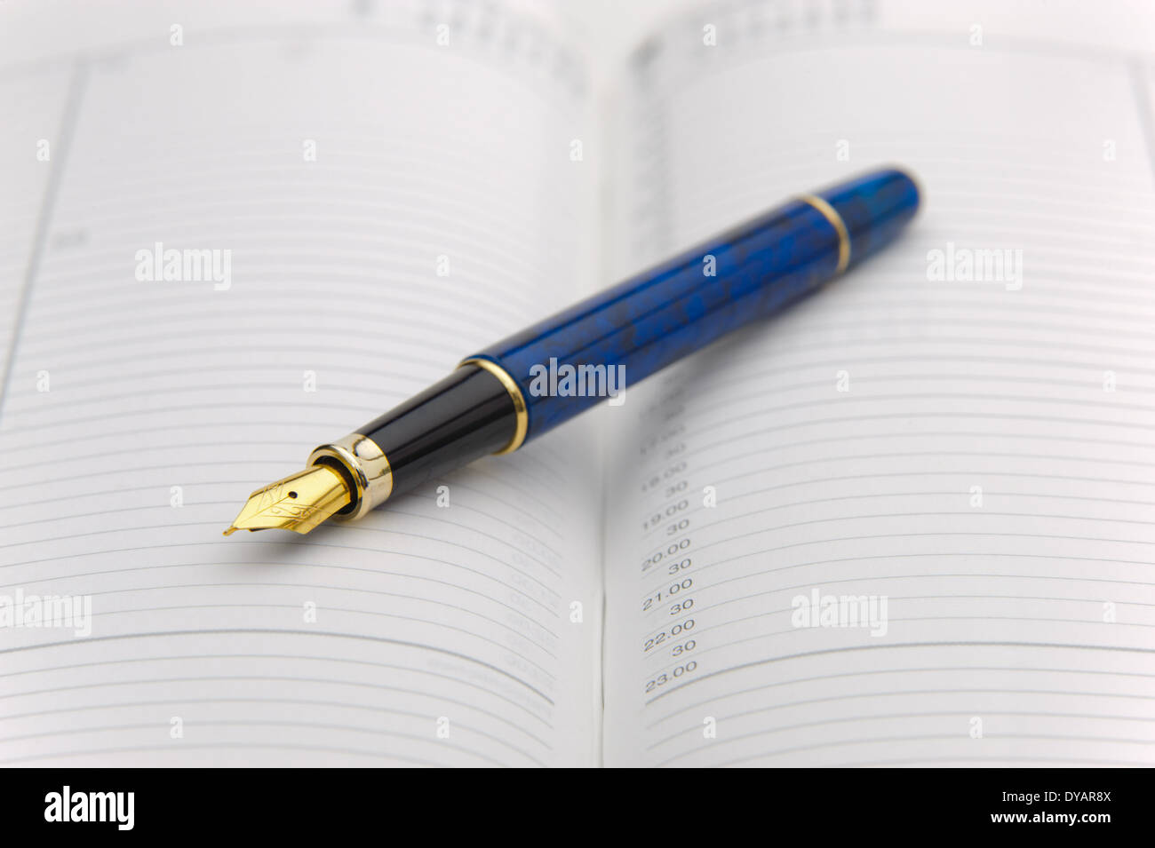 blank time planner with fountain pen Stock Photo - Alamy