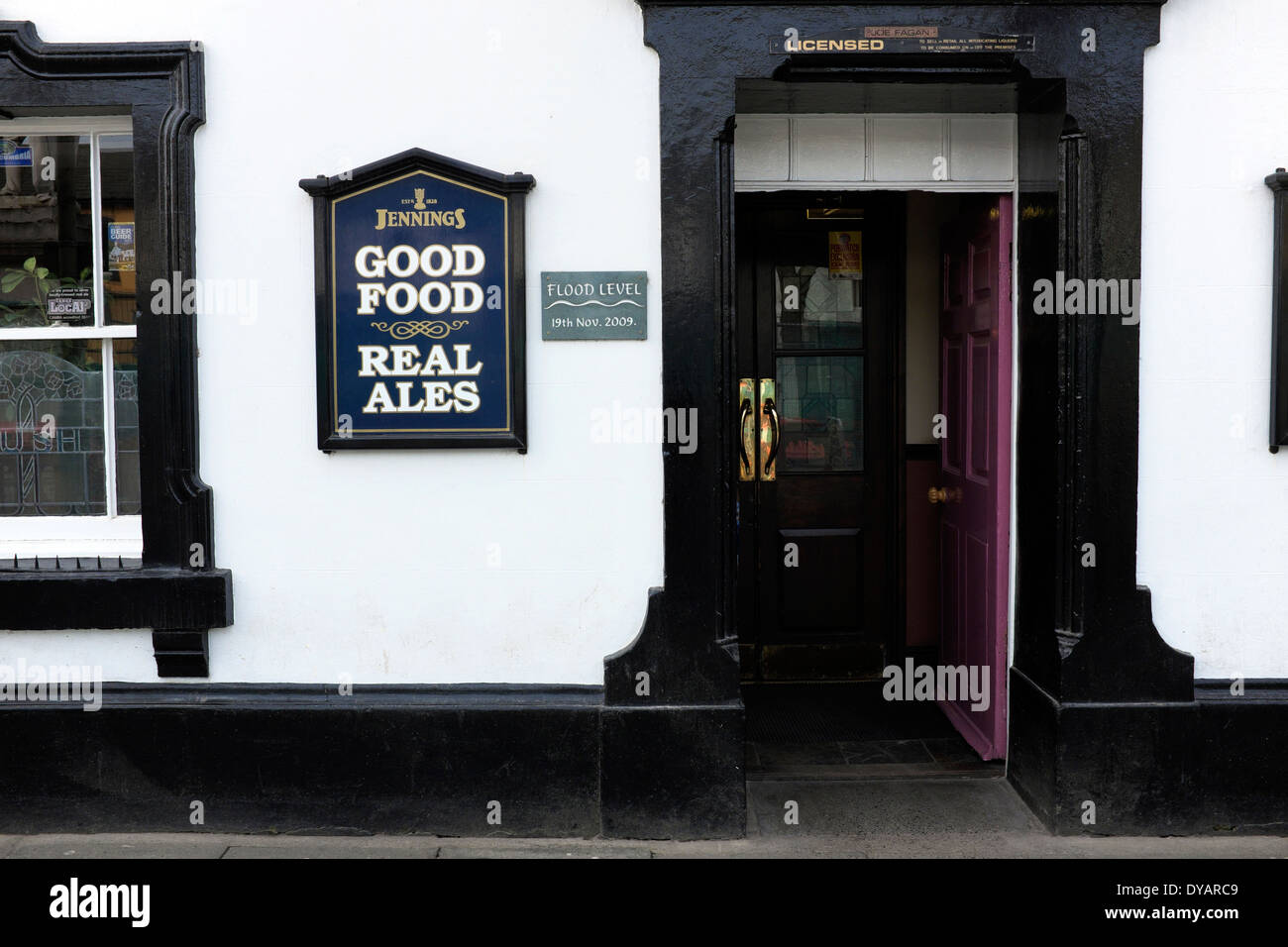 A marking on the wall of a pub in Cockermouth Main Street showing where ...