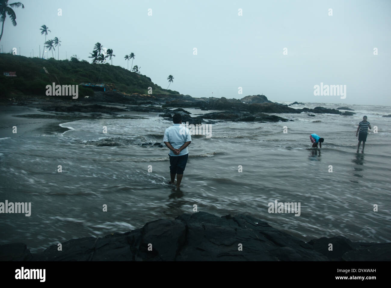family enjoying on the vagator beach in Goa Stock Photo - Alamy