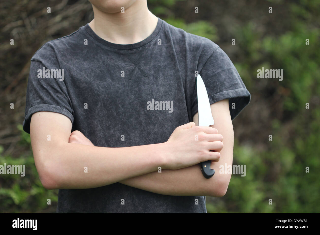 Teenage Boy With Knife Stock Photo - Alamy