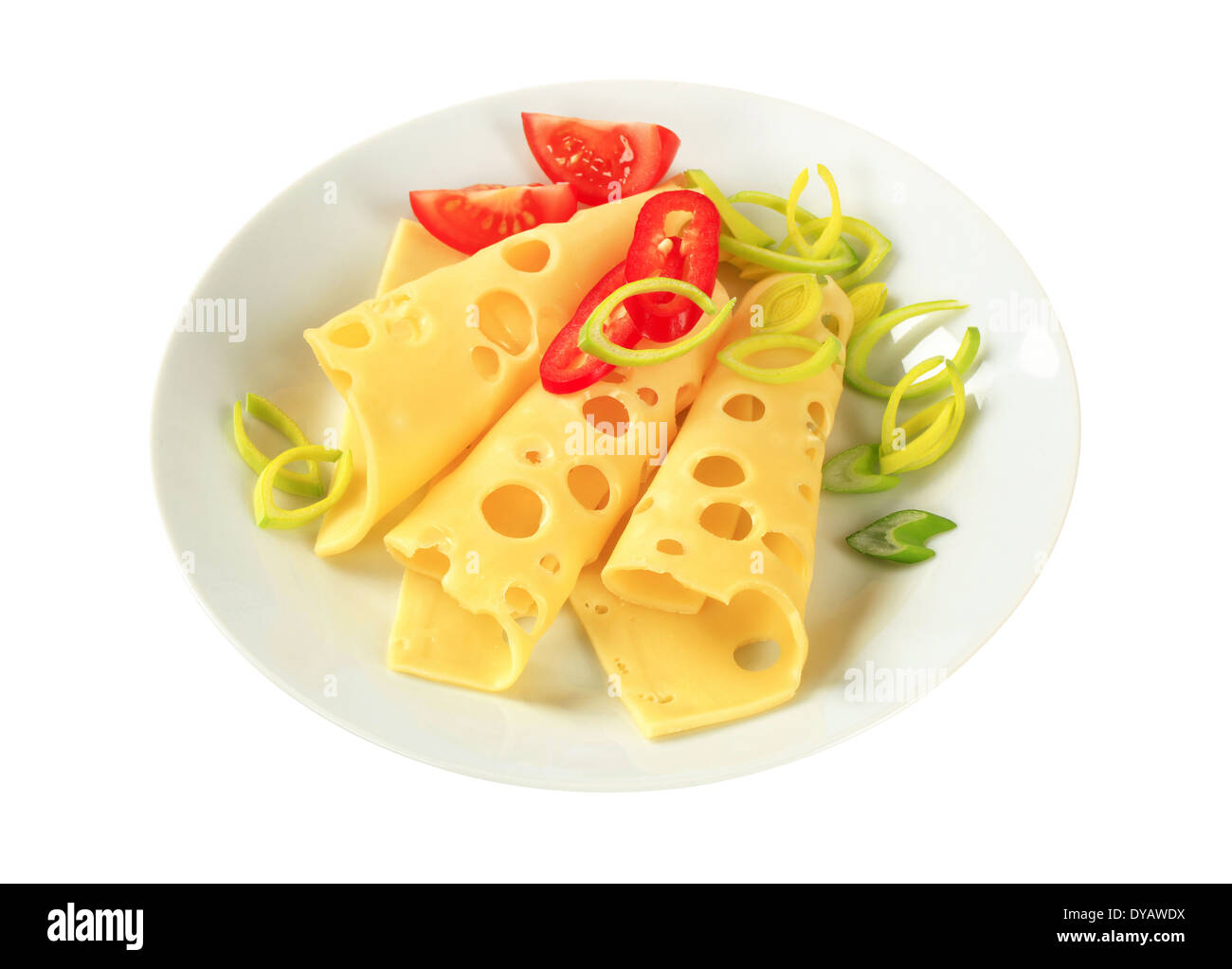 Slices of Swiss cheese sprinkled with chopped leek Stock Photo - Alamy