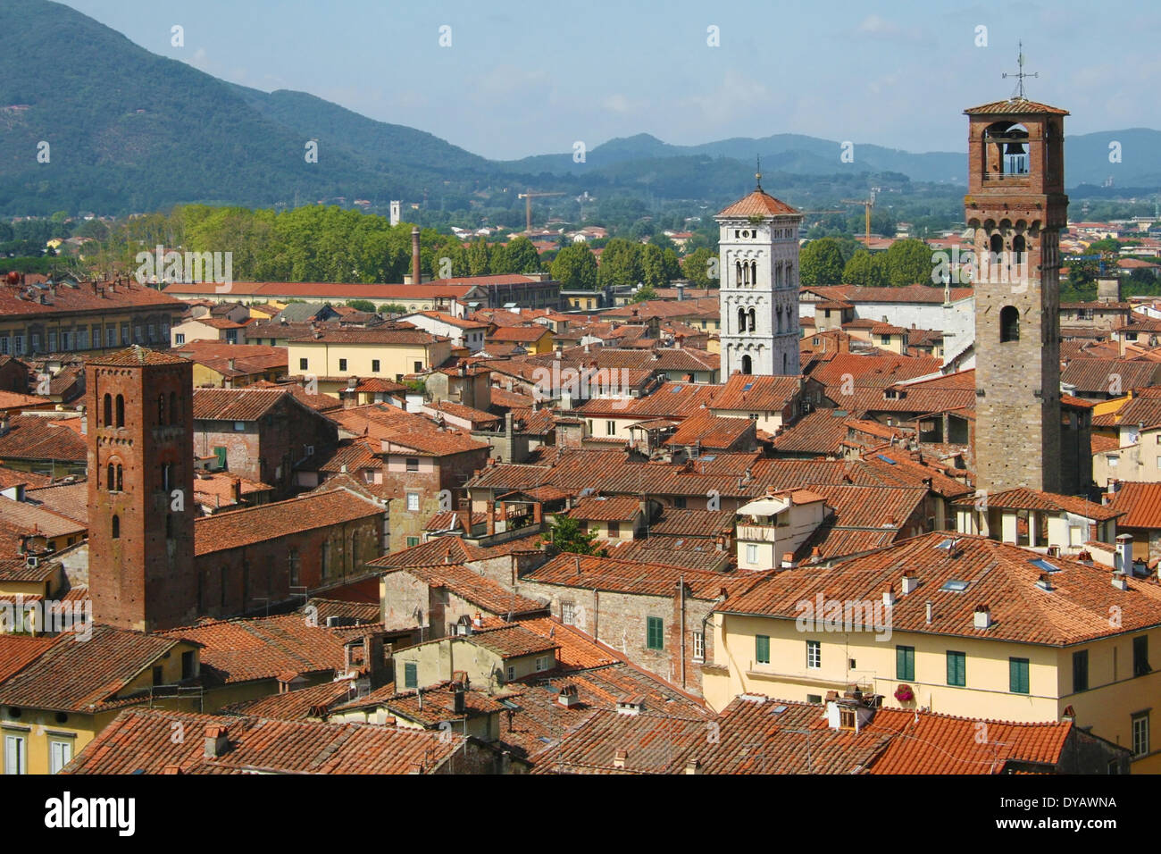 Three bell towers in the old town of Lucca, Tuscany, Italy Stock Photo ...
