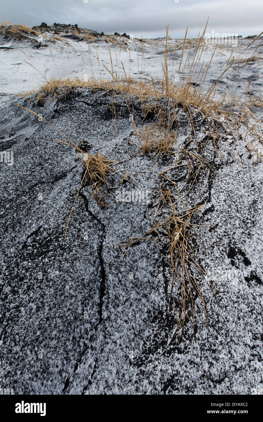 Light snowfall over a fresh dark layer of volcanic ashes, Iceland Stock ...