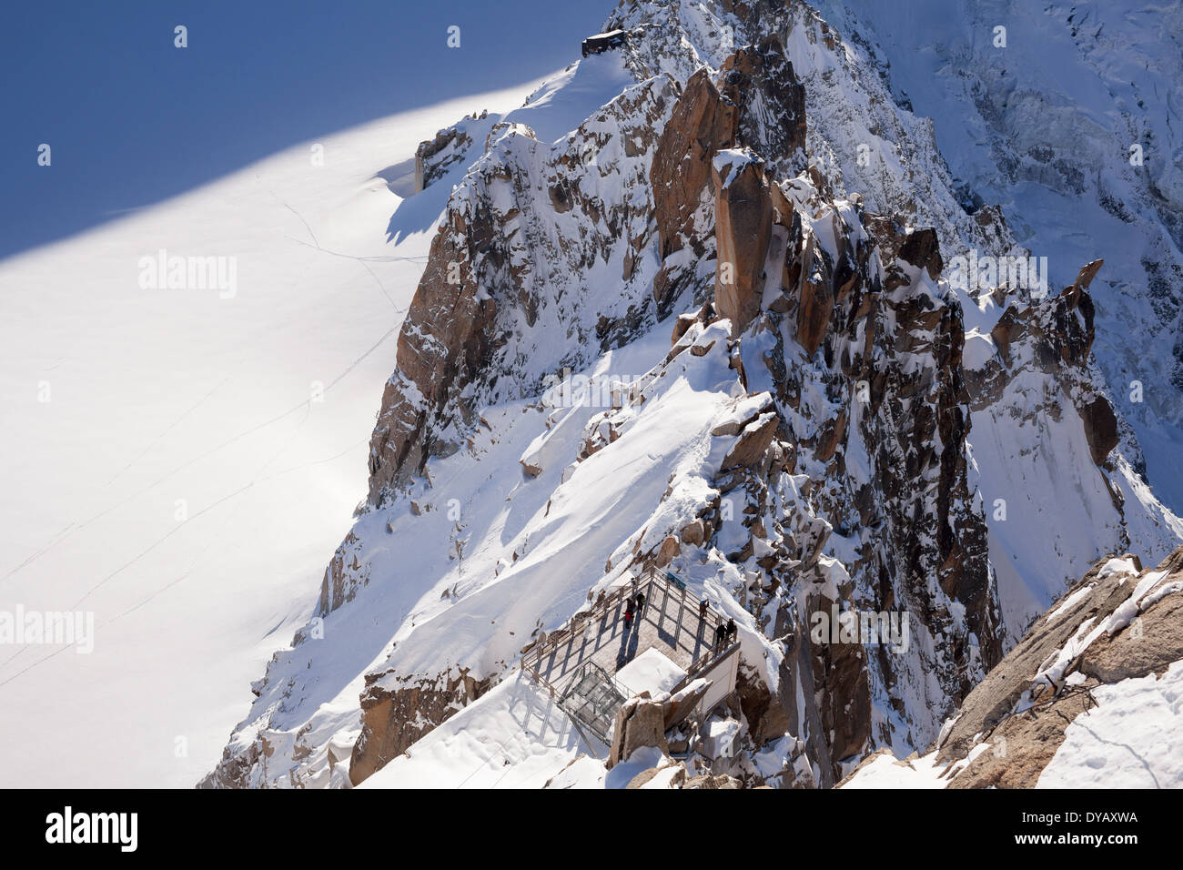 Tourists visit a lookout point at the Aiguille Du Midi (3842m) mountain ...