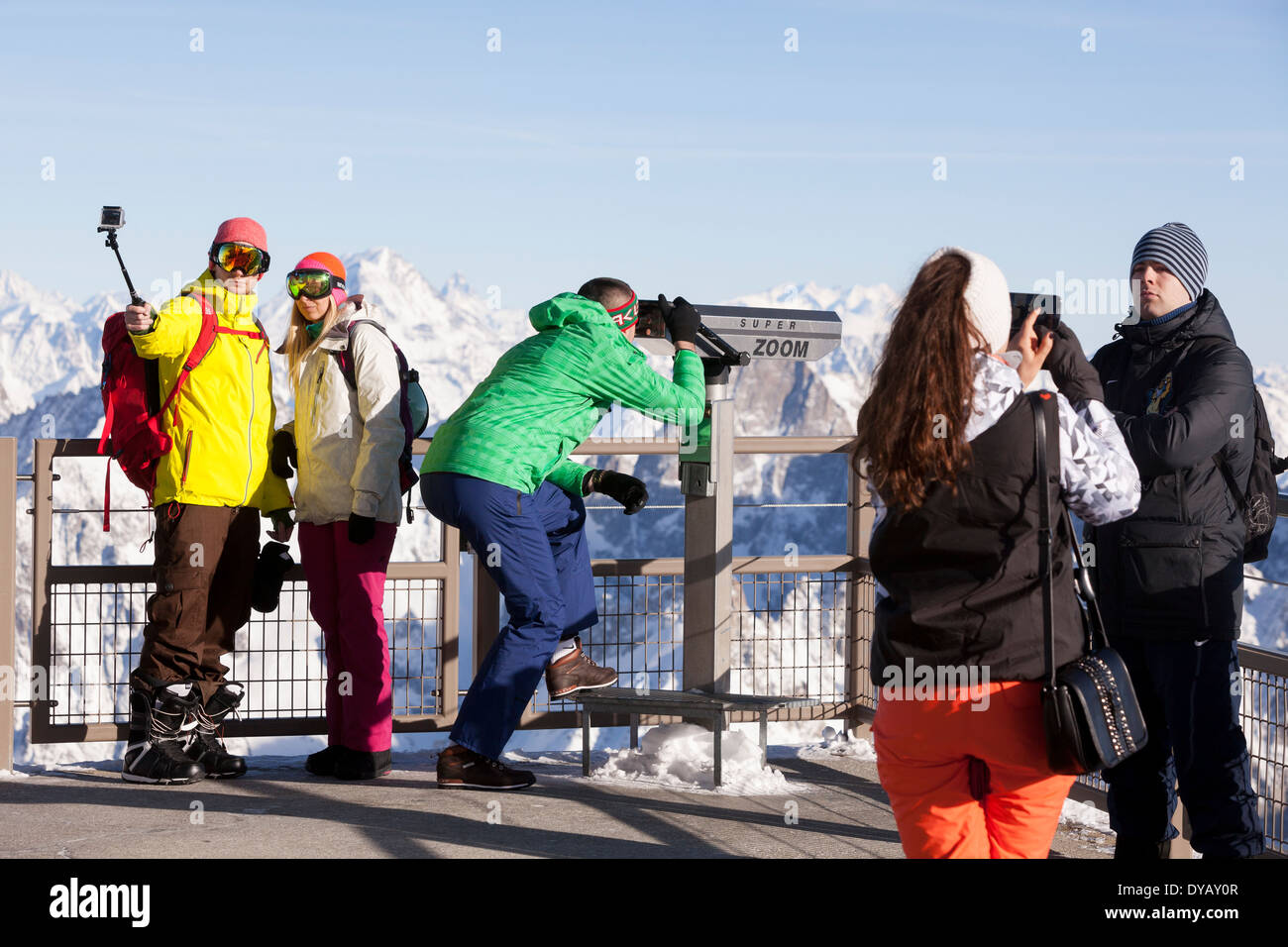 Tourists take photographs of themselves while visiting the Aiguille Du ...