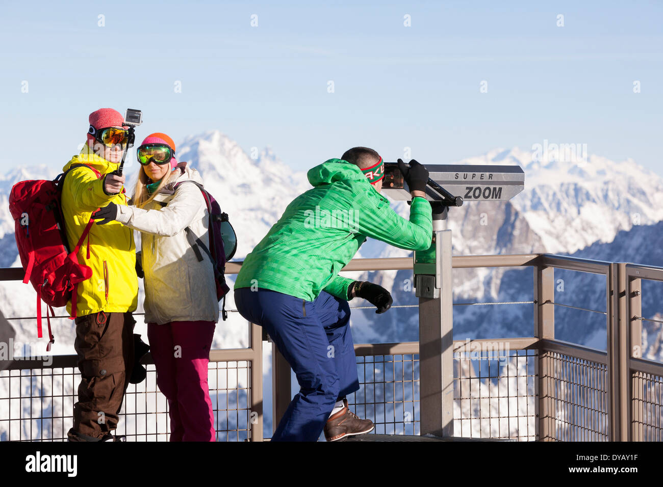 Tourists take photographs of themselves while visiting the Aiguille Du ...