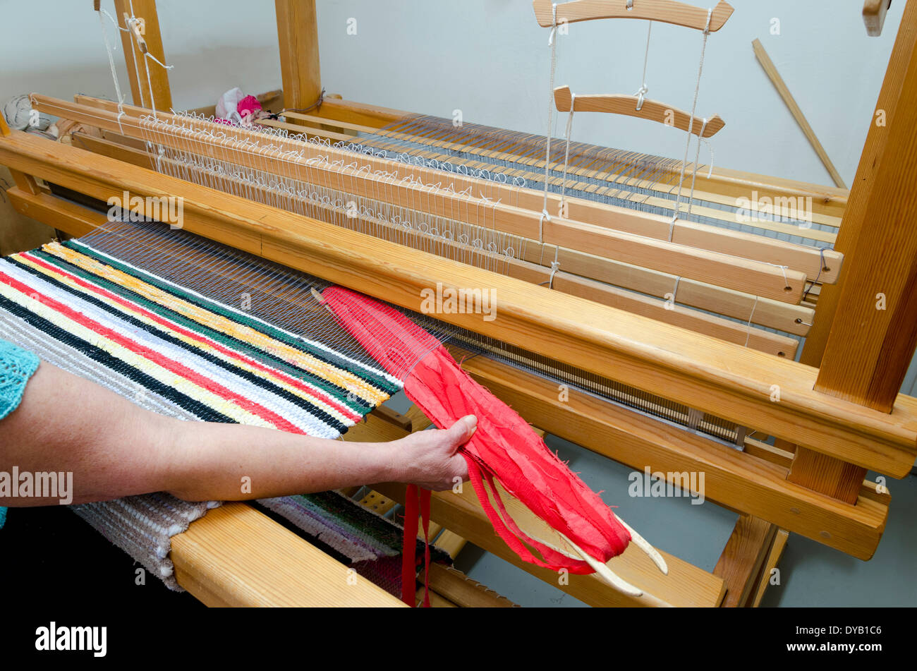 How the cloth strips is used in a loom to create the pattern Stock ...