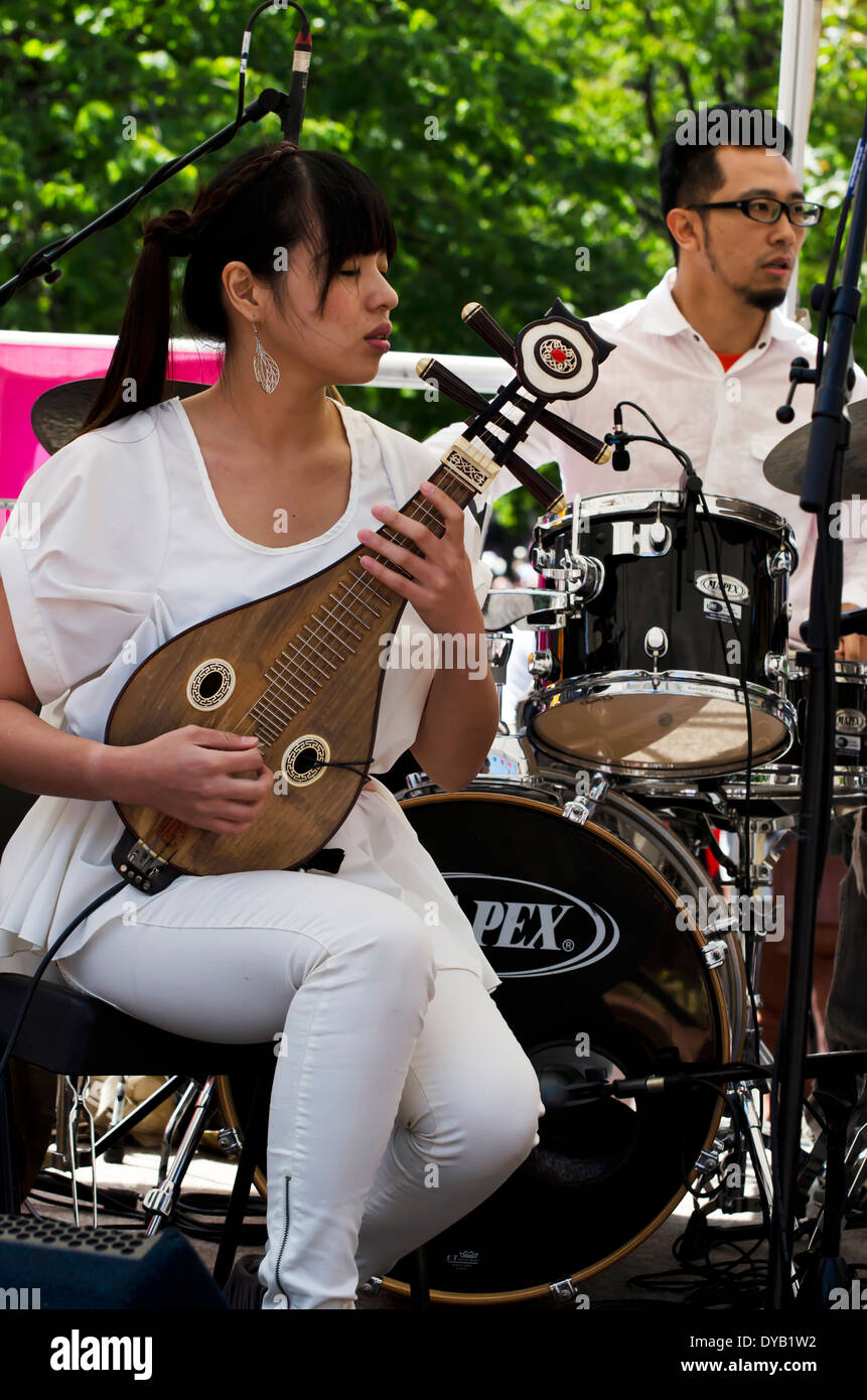 Chinese girl playing instrument hi-res stock photography and images - Alamy