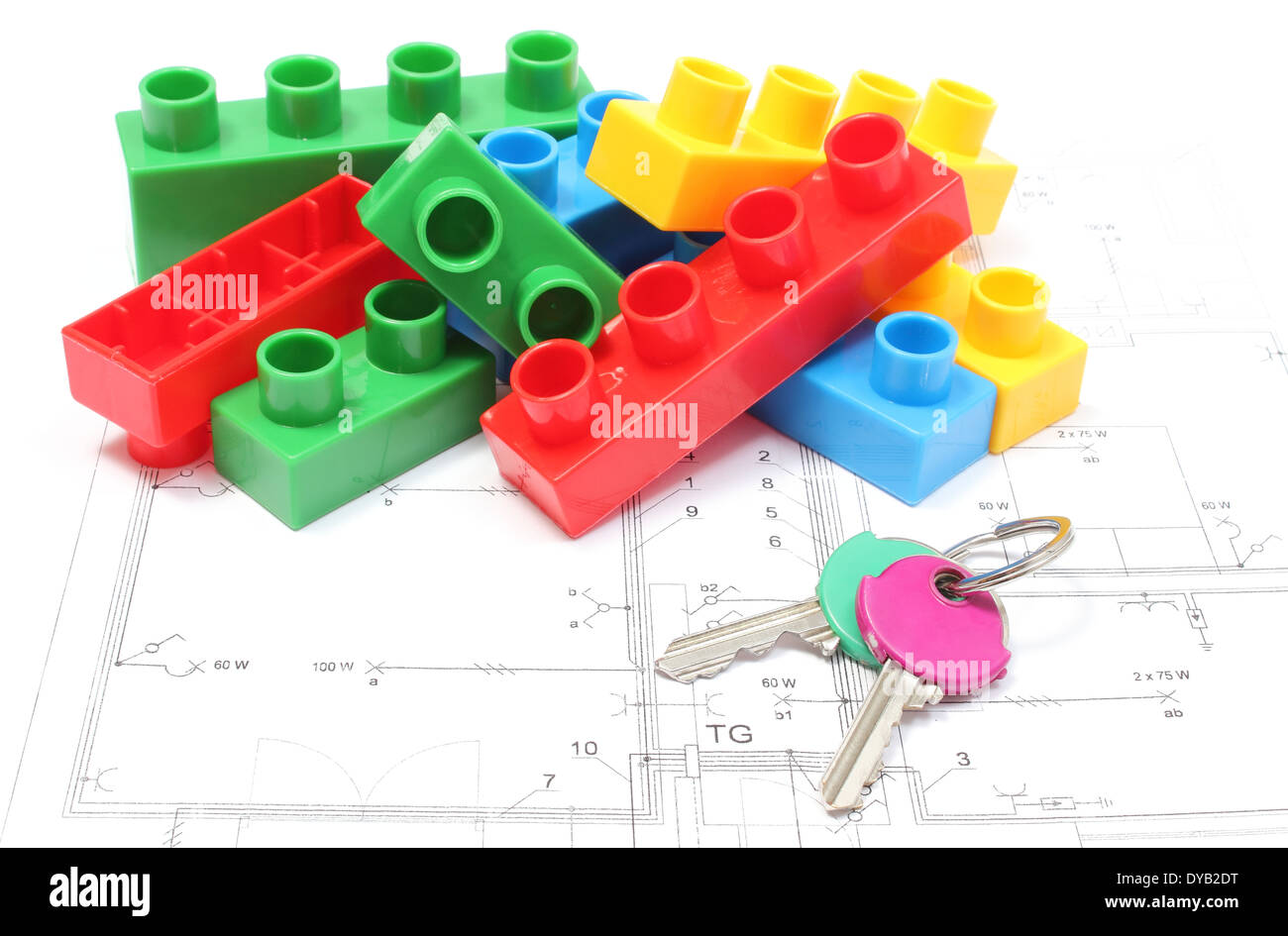 Home keys and heap of colorful building blocks lying on construction ...