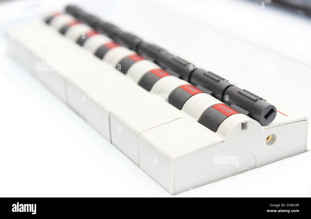 Electric switch on a white control panel Stock Photo - Alamy