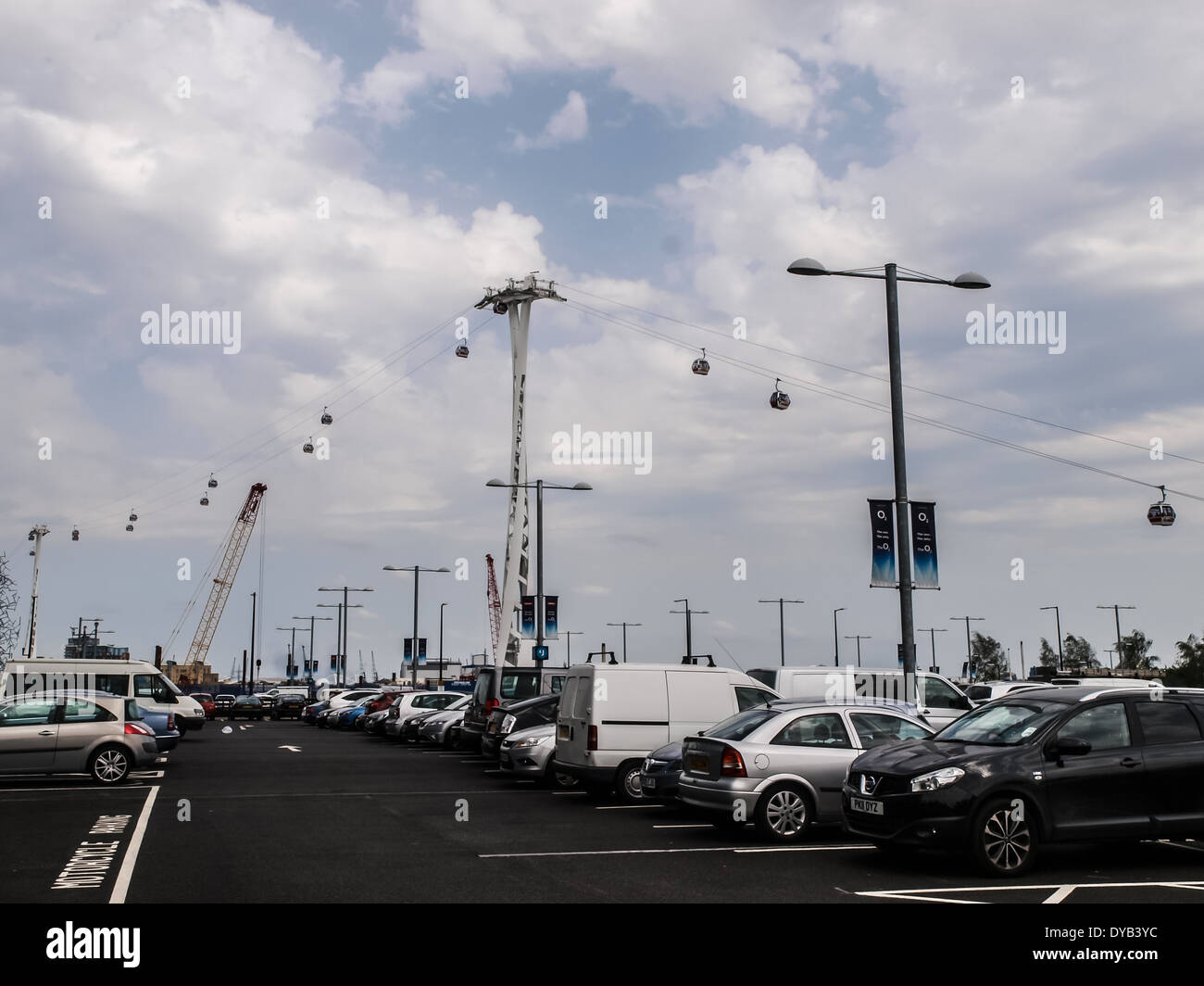 Emirates Air Line cable cars traveling above a car park at the ...