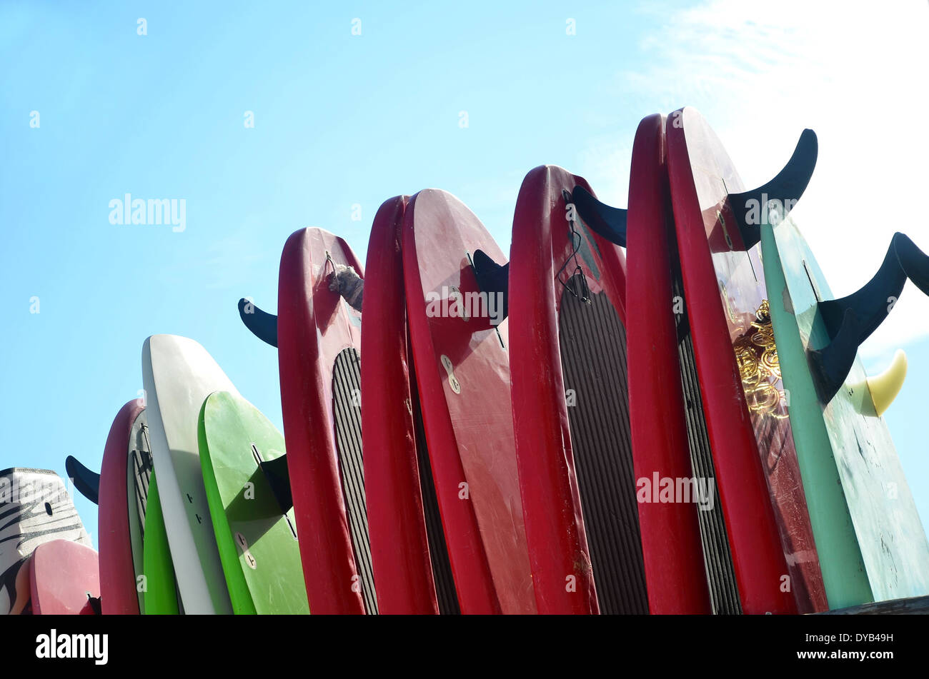 Stack of surfboards by seaside Stock Photo - Alamy