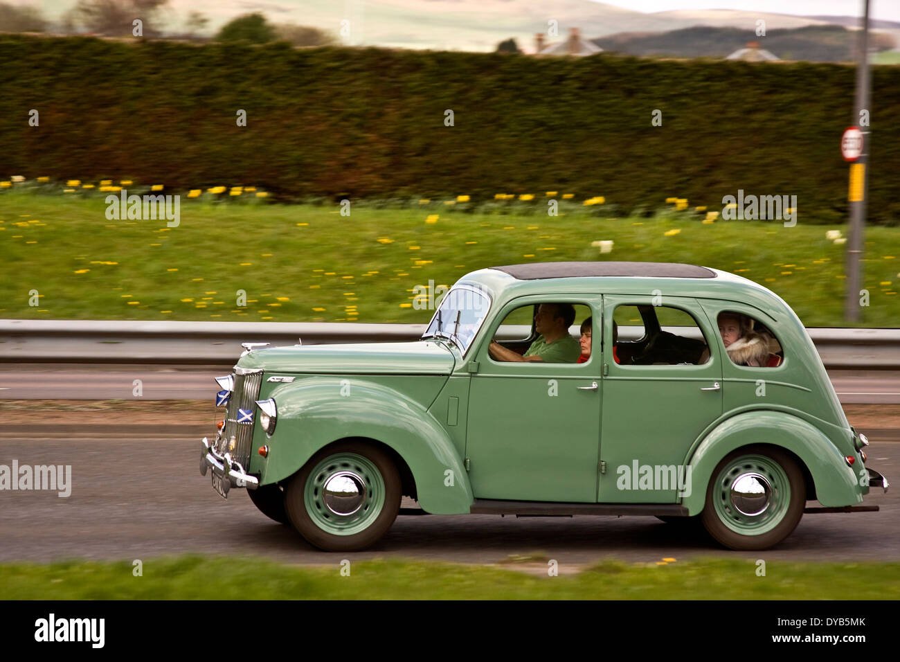 Panning a British Ford Prefect E493A Post War car travelling along the ...