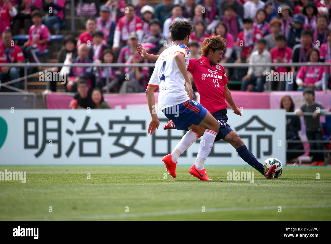 Osaka, Japan. 29th Mar, 2014. (R-L) Takumi Minamino (Cerezo), Michael ...