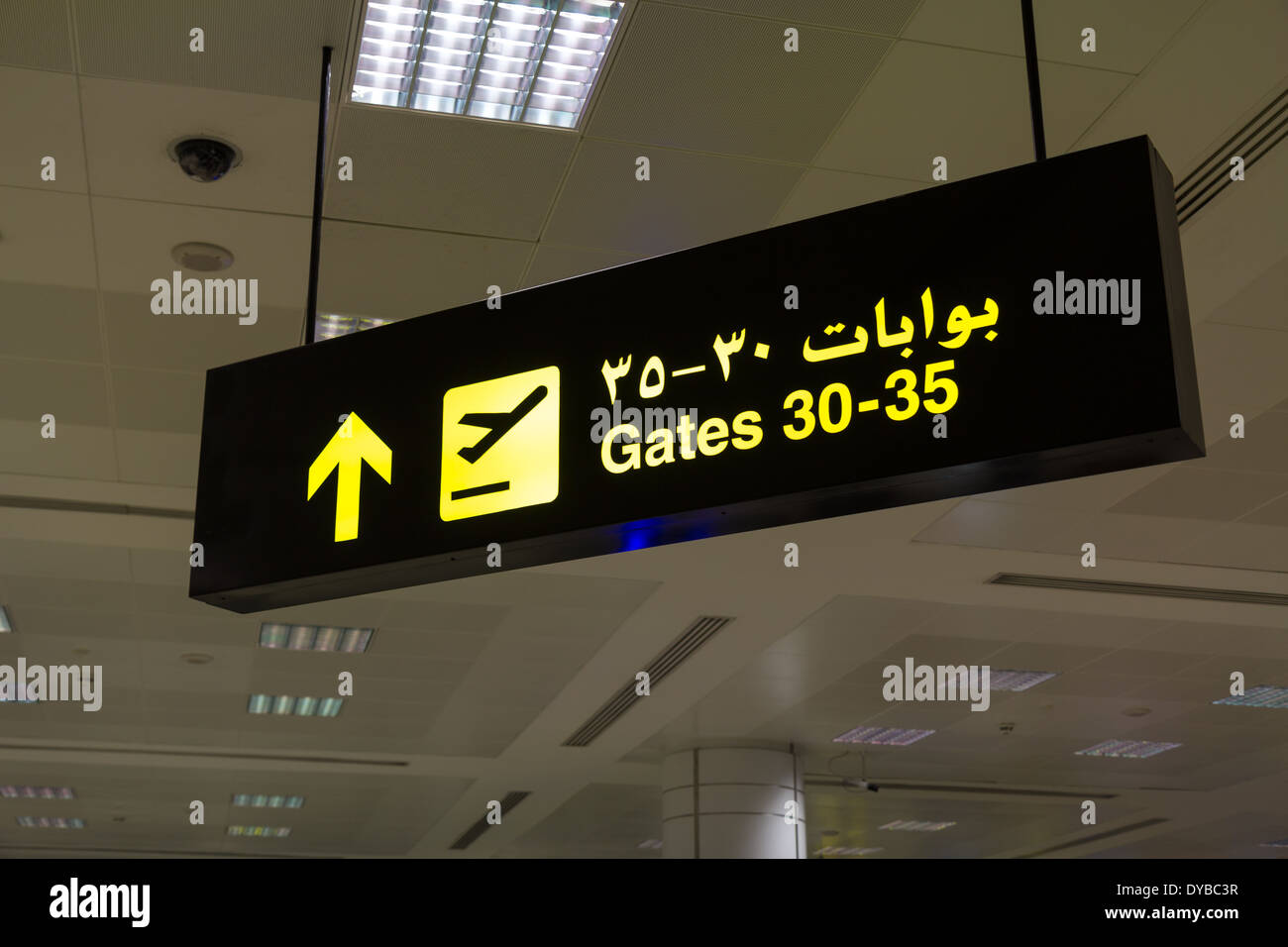 Yellow on black background gates sign in airport Stock Photo - Alamy