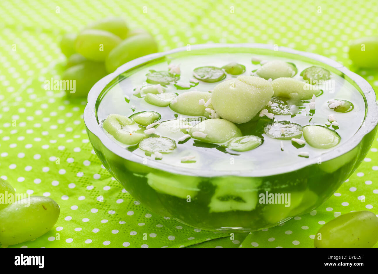 Delicious fruit jelly with grapes dusted with coconut shreds Stock ...