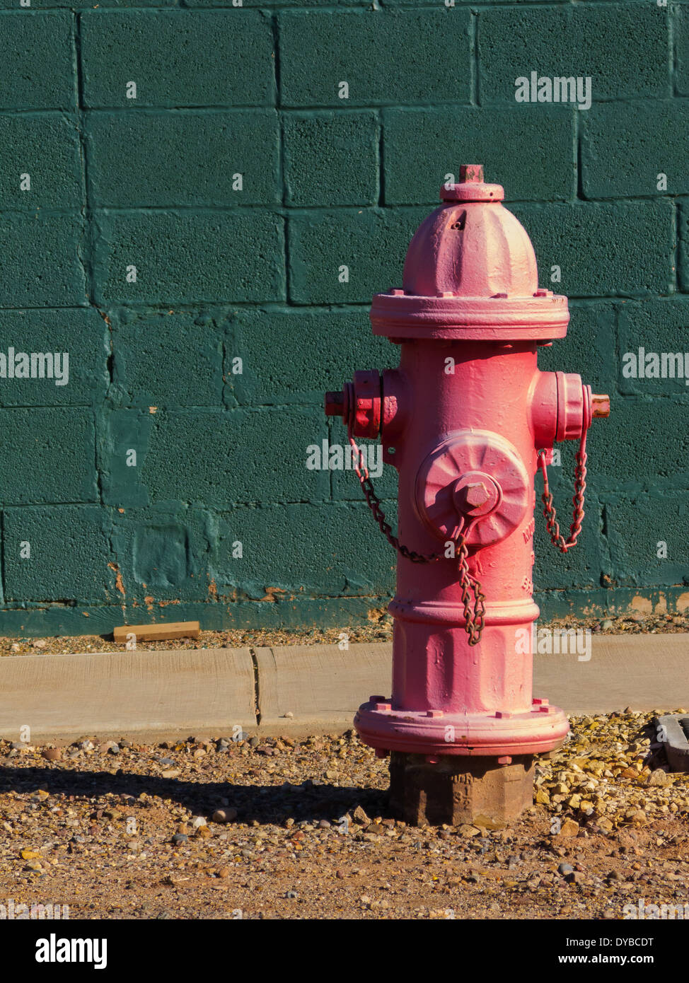 Fire hydrant by green painted wall Winslow Arizona Stock Photo - Alamy
