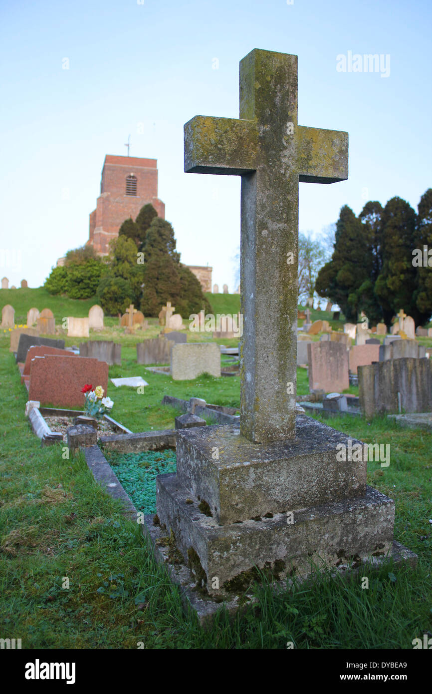 A gravestone cross in the graveyard in Shillington Church in ...