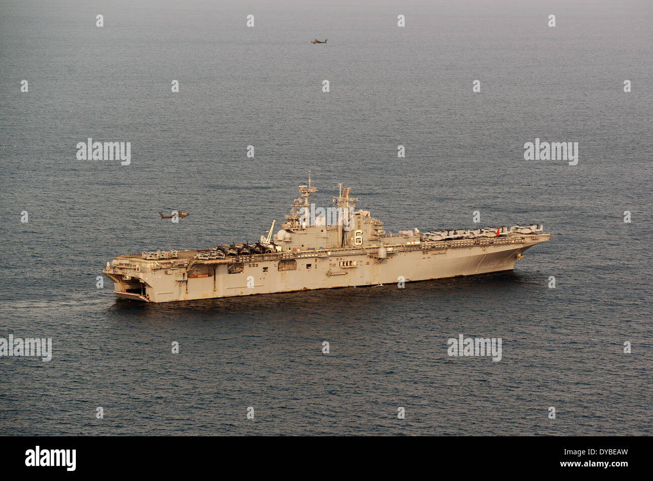 US Navy Apache Longbow attack helicopters conduct flight operations ...