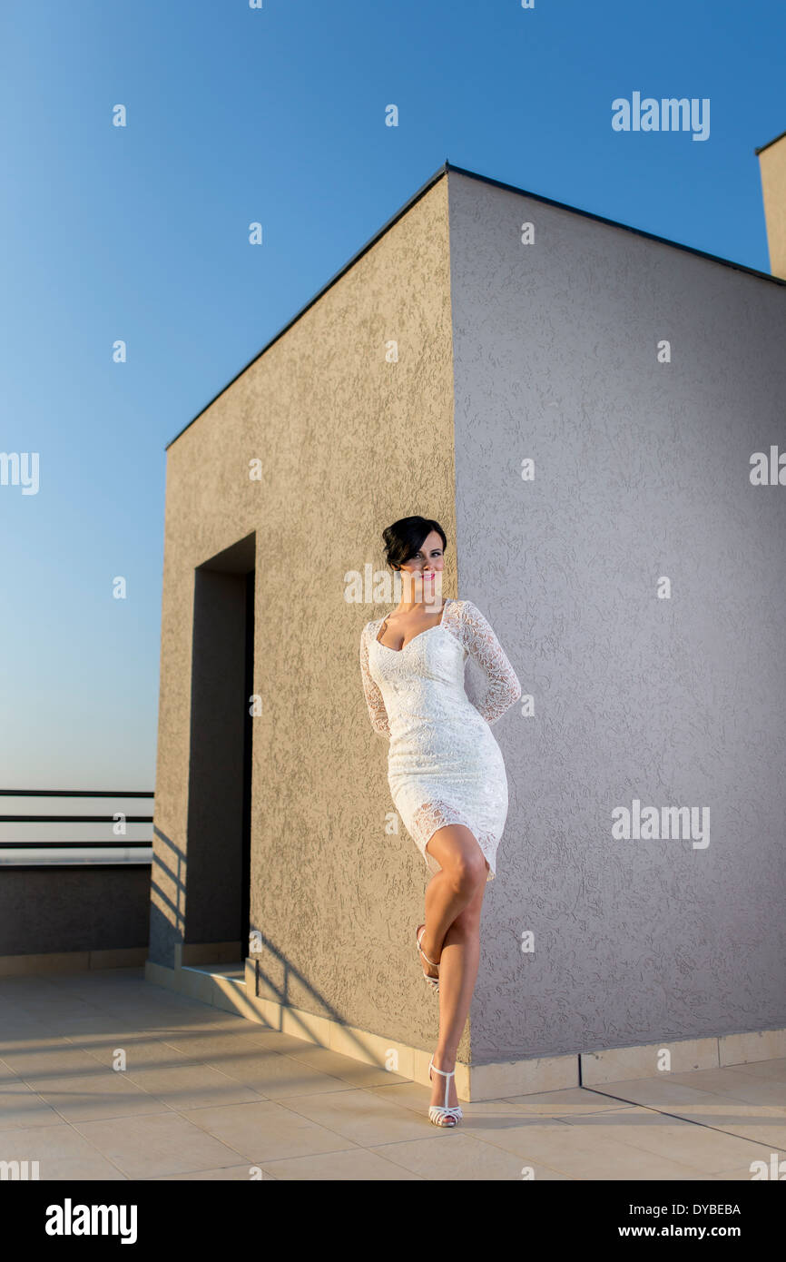 Girl sitting roof hi-res stock photography and images - Alamy