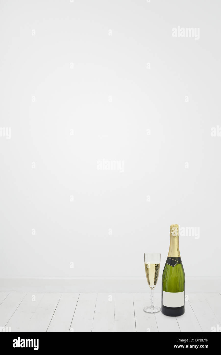 Bottle of Champagne with a blank label and full champagne glass Stock ...