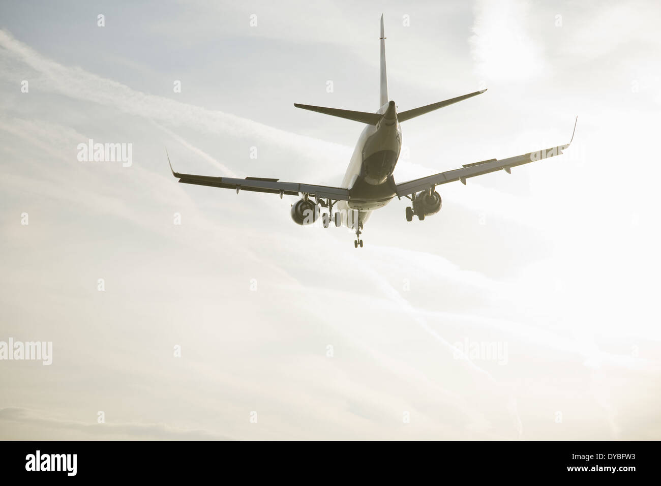Passenger airplane coming into land Stock Photo - Alamy