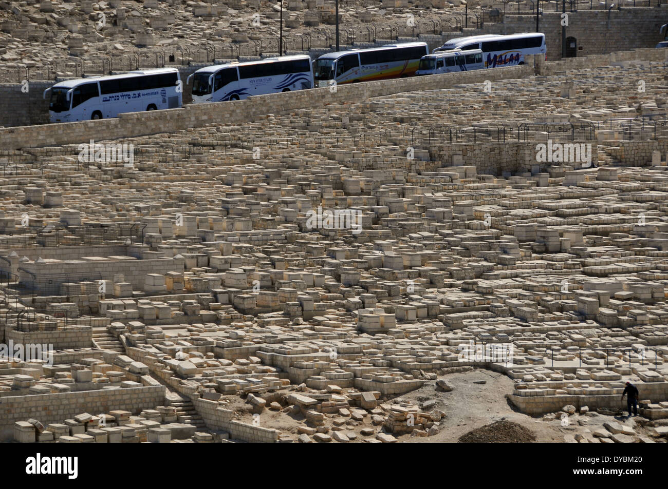 Tour buses and tombs in the Jewish cemetery of the Mount of Olives ...