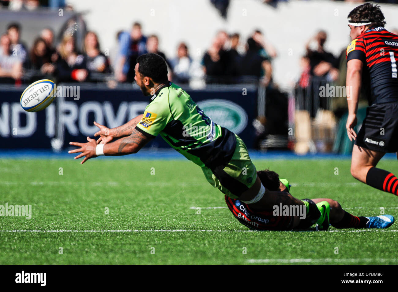 London, UK. 13th Apr, 2014. Samu MANOA of Northampton Saints offloads ...