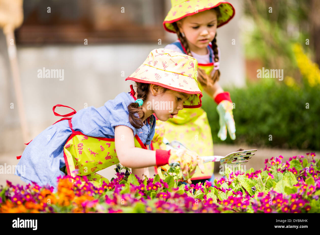 Little girls in the garden Stock Photo - Alamy