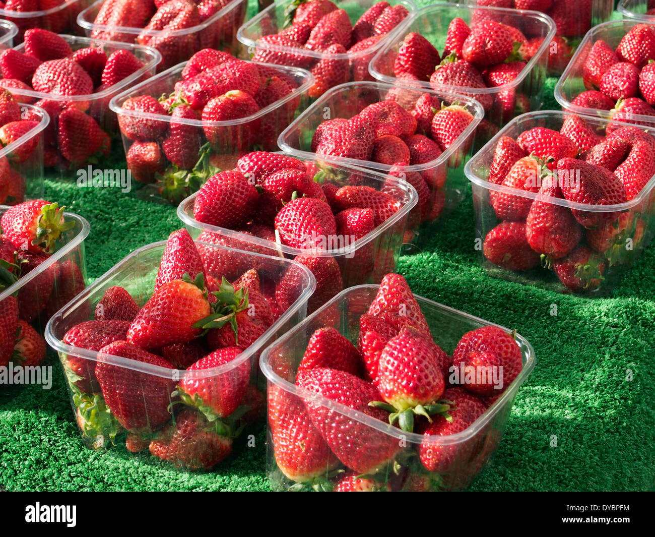 Punnets of deep red strawberries on a market stall Stock Photo - Alamy