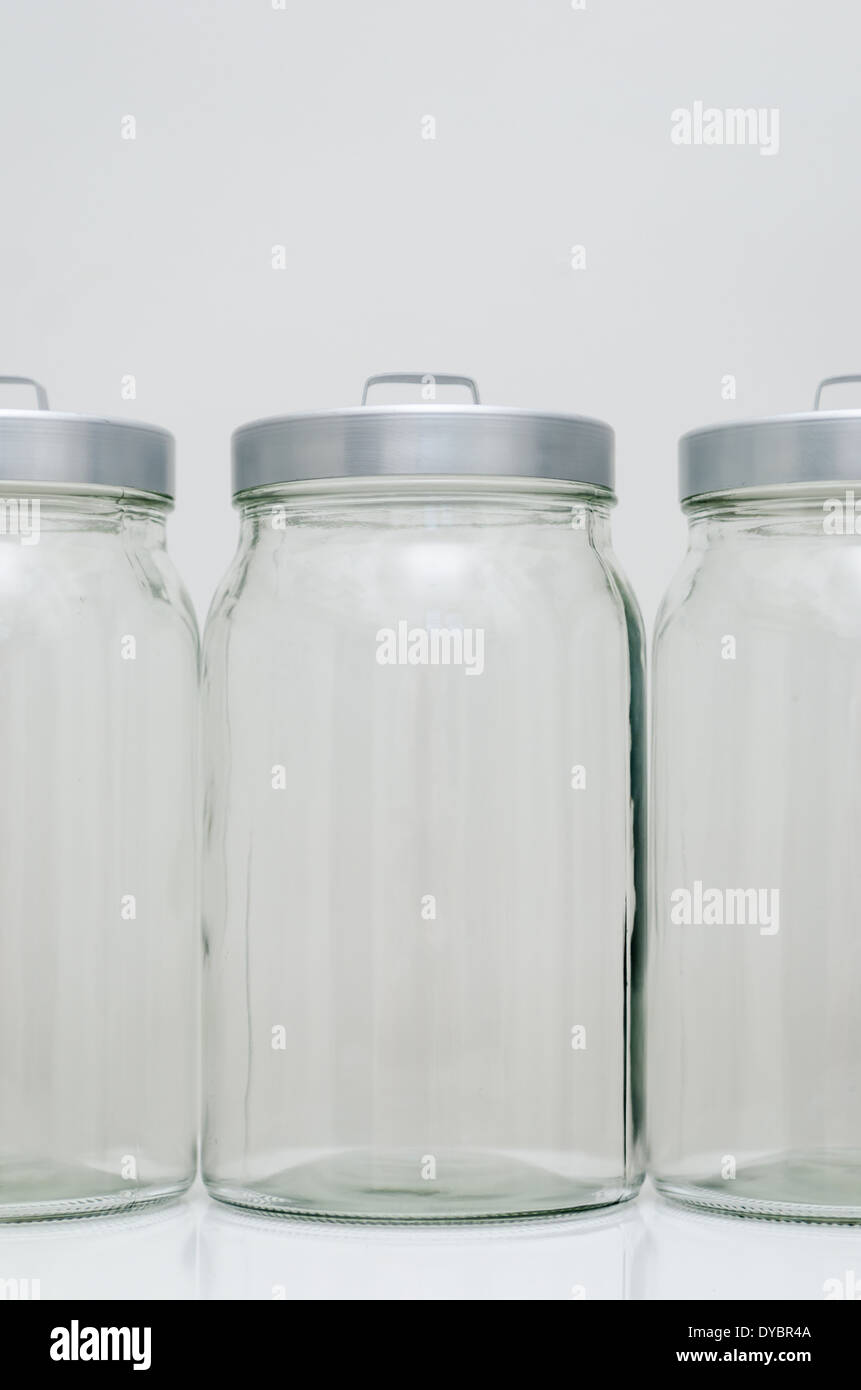 Three empty jars on a white background Stock Photo - Alamy